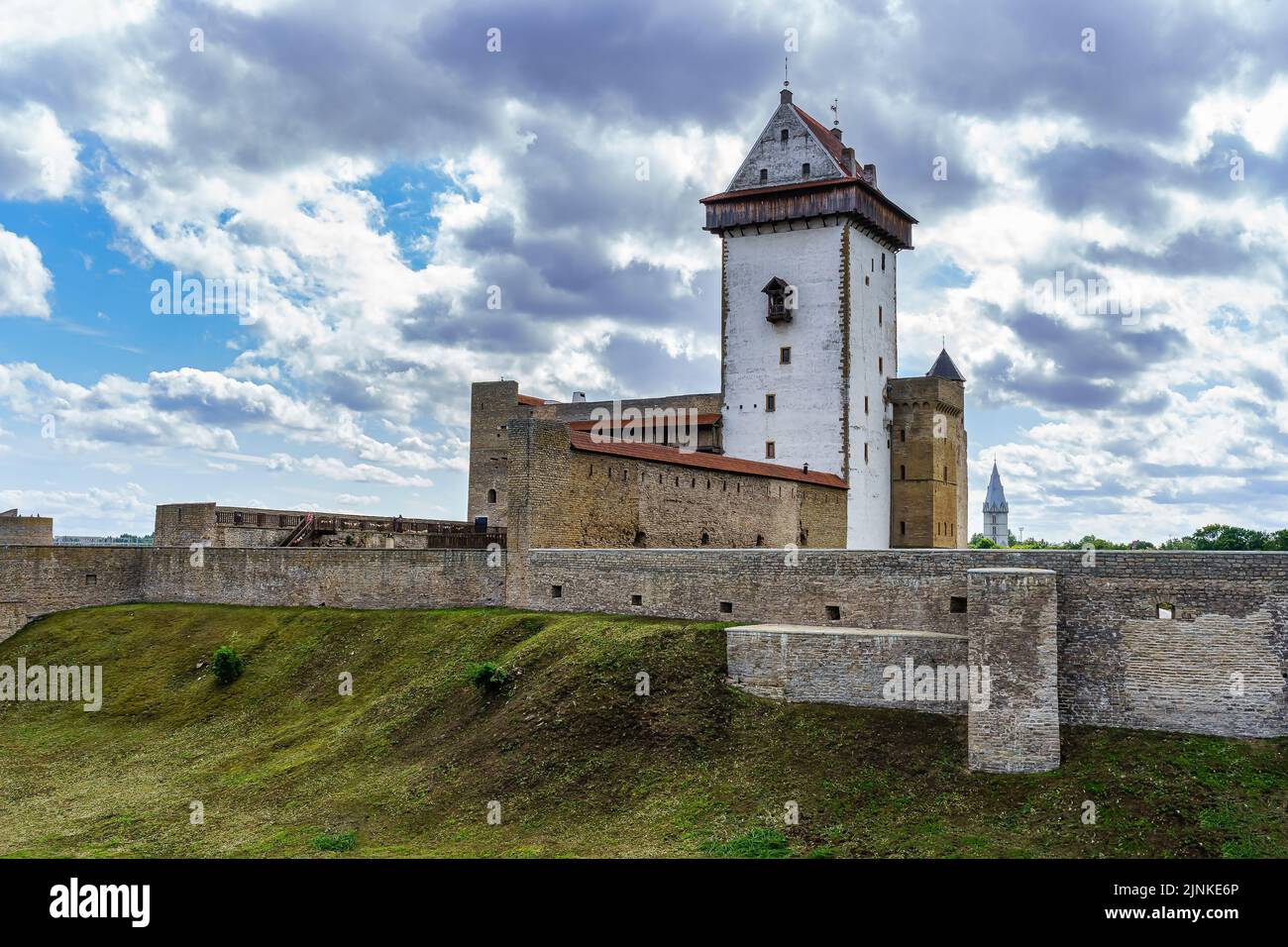 Medieval castle with its defensive tower and its ramparts at sunset ...