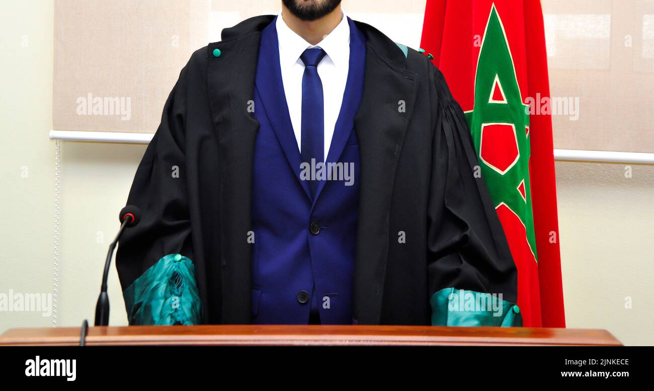 A Moroccan lawyer giving a lecture in front of a Moroccan flag Stock ...