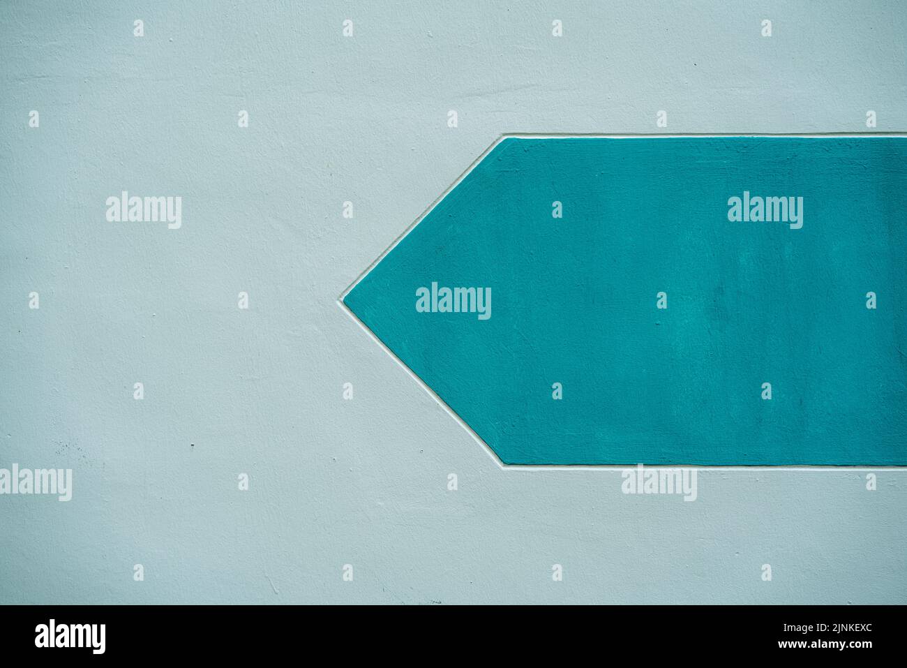 Arrow on an light green textured surface. Direction indicator. Perfect ...