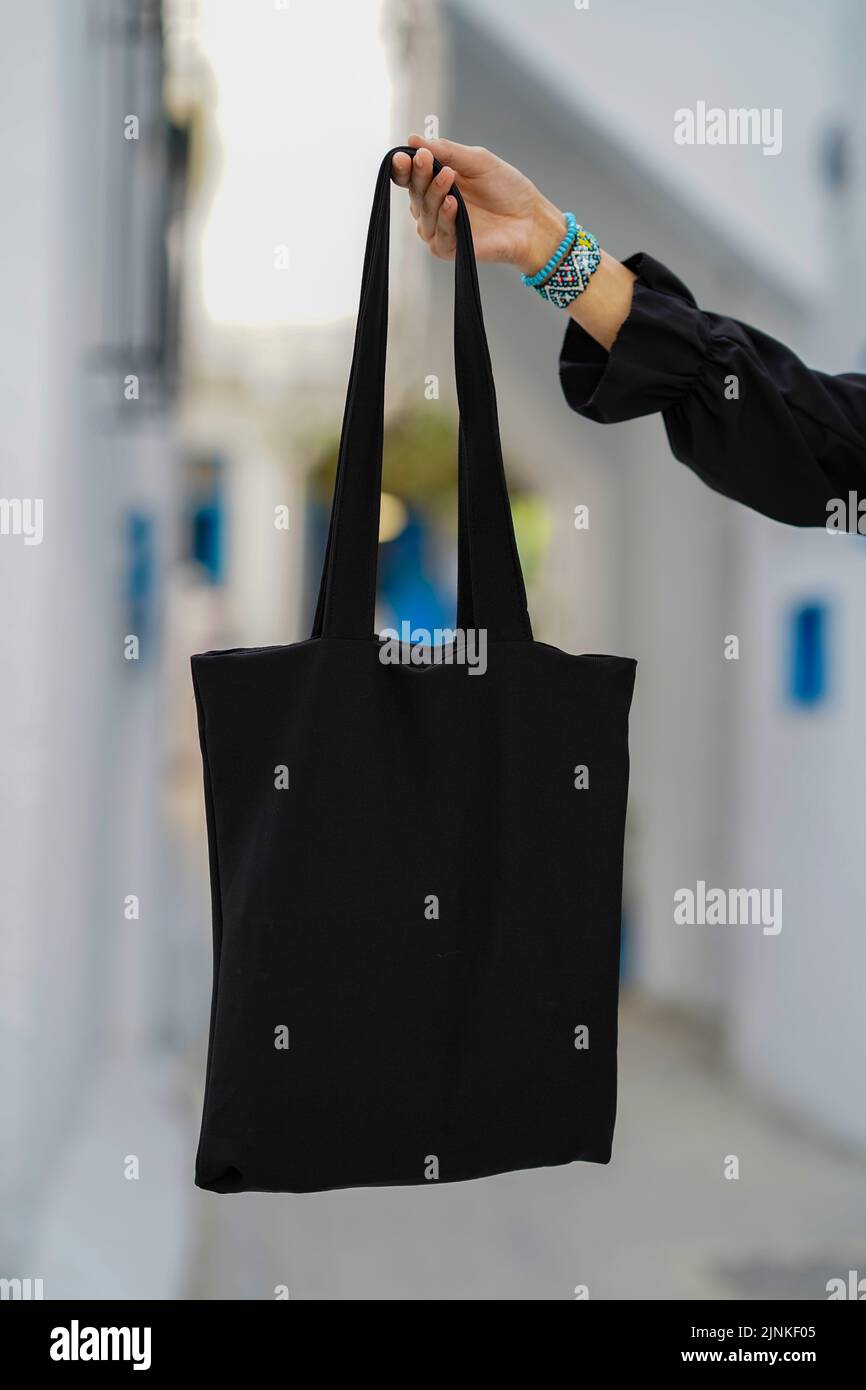 Carrying tote bags hi-res stock photography and images - Alamy