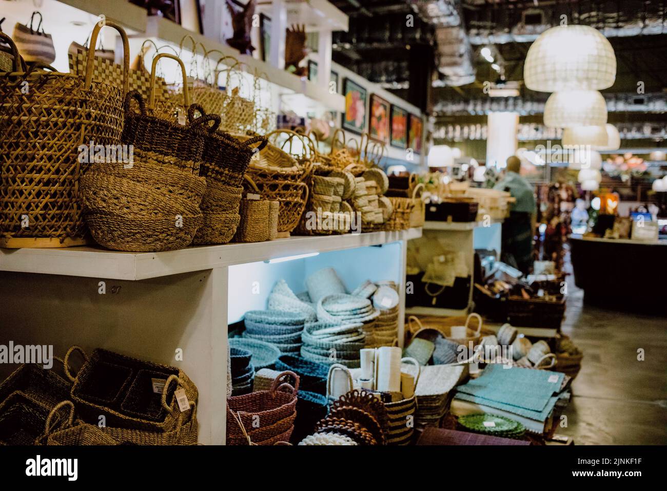 A store interior with wicker baskets on shelves in Romblon, the ...
