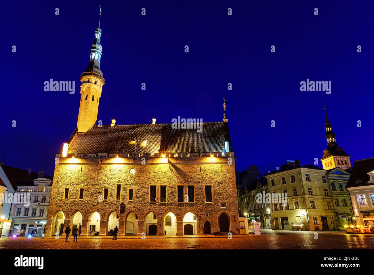 Tallinn Town Hall Square illuminated at night after raining Stock Photo ...