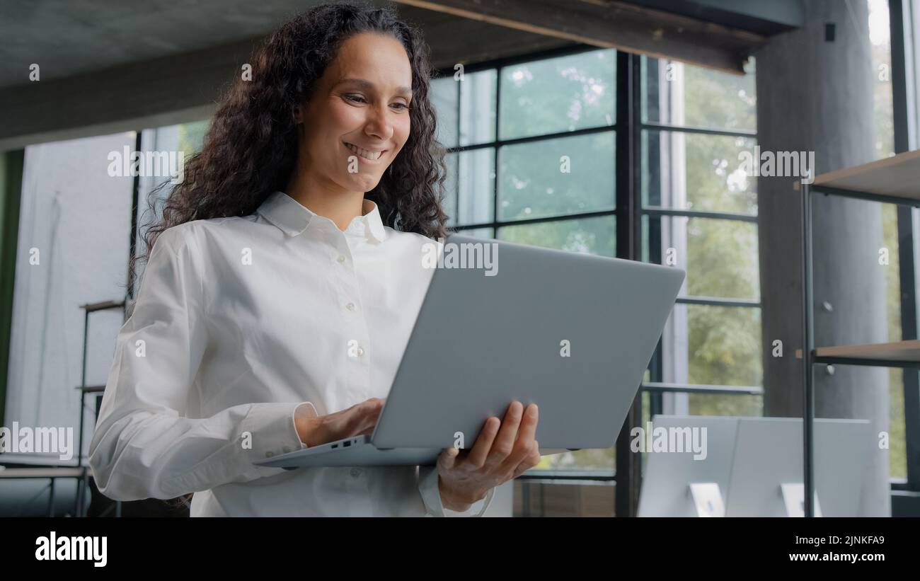 Successful businesswoman working in modern office typing on laptop ...
