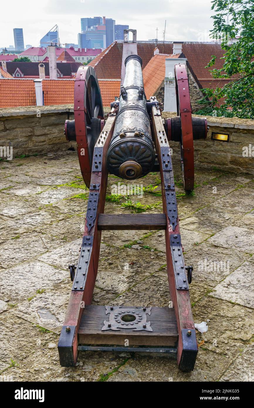 Ancient metal cannon defending the medieval city wall Stock Photo - Alamy