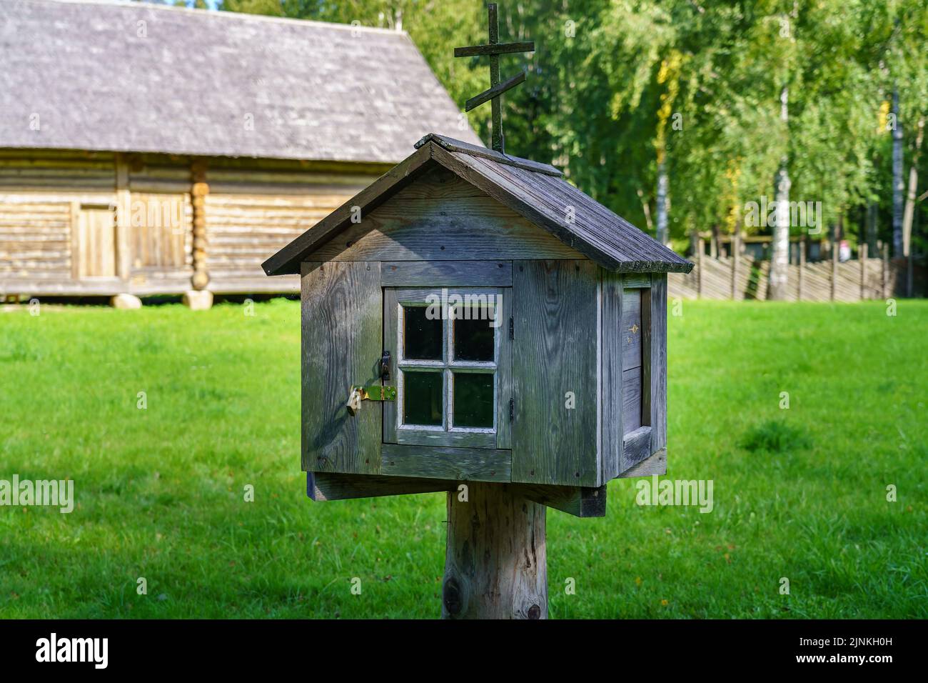 Old wooden mailbox on a post outside the house Stock Photo - Alamy