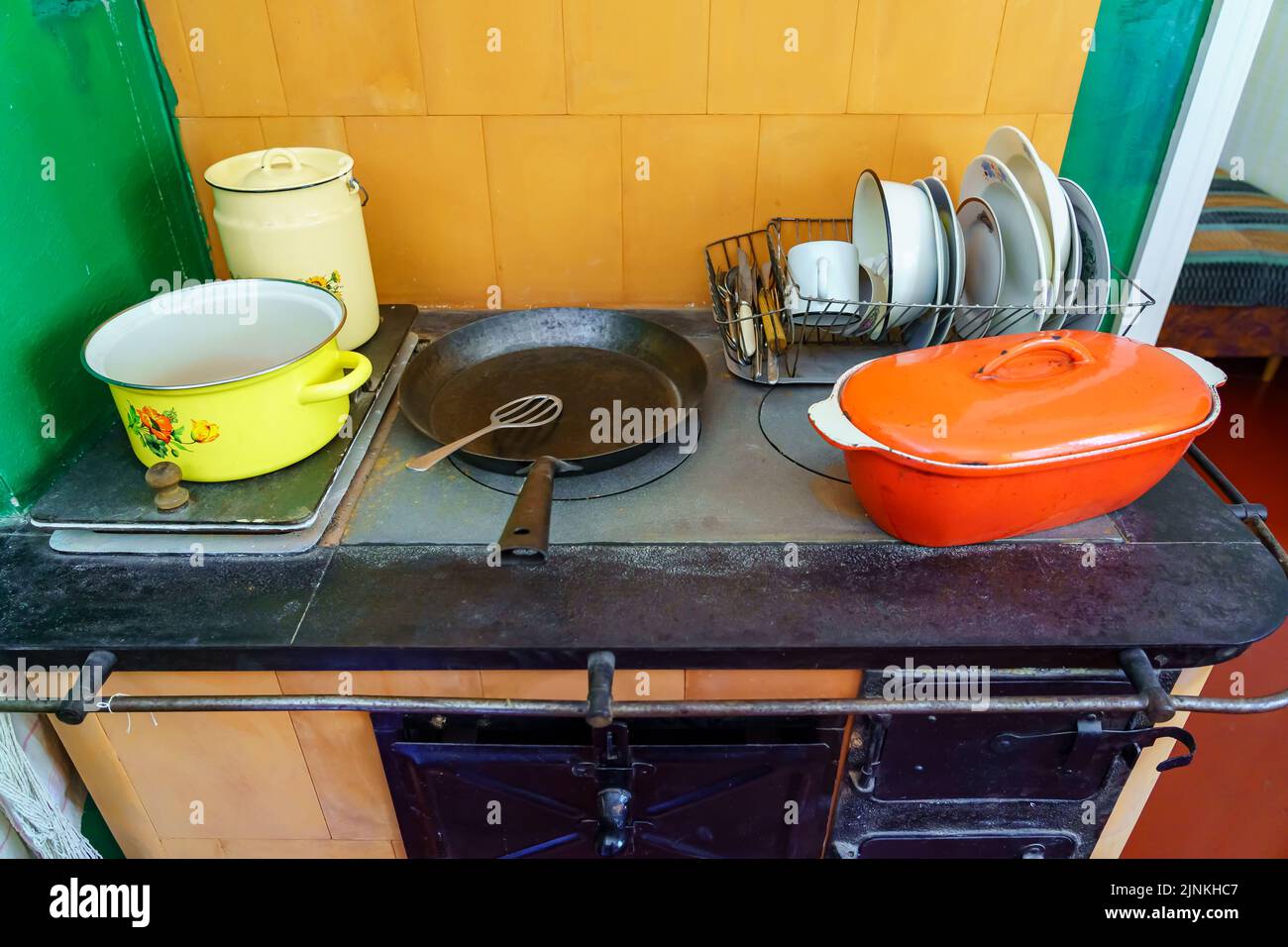 Very old metal kitchen with pans and pots from bygone times Stock Photo ...