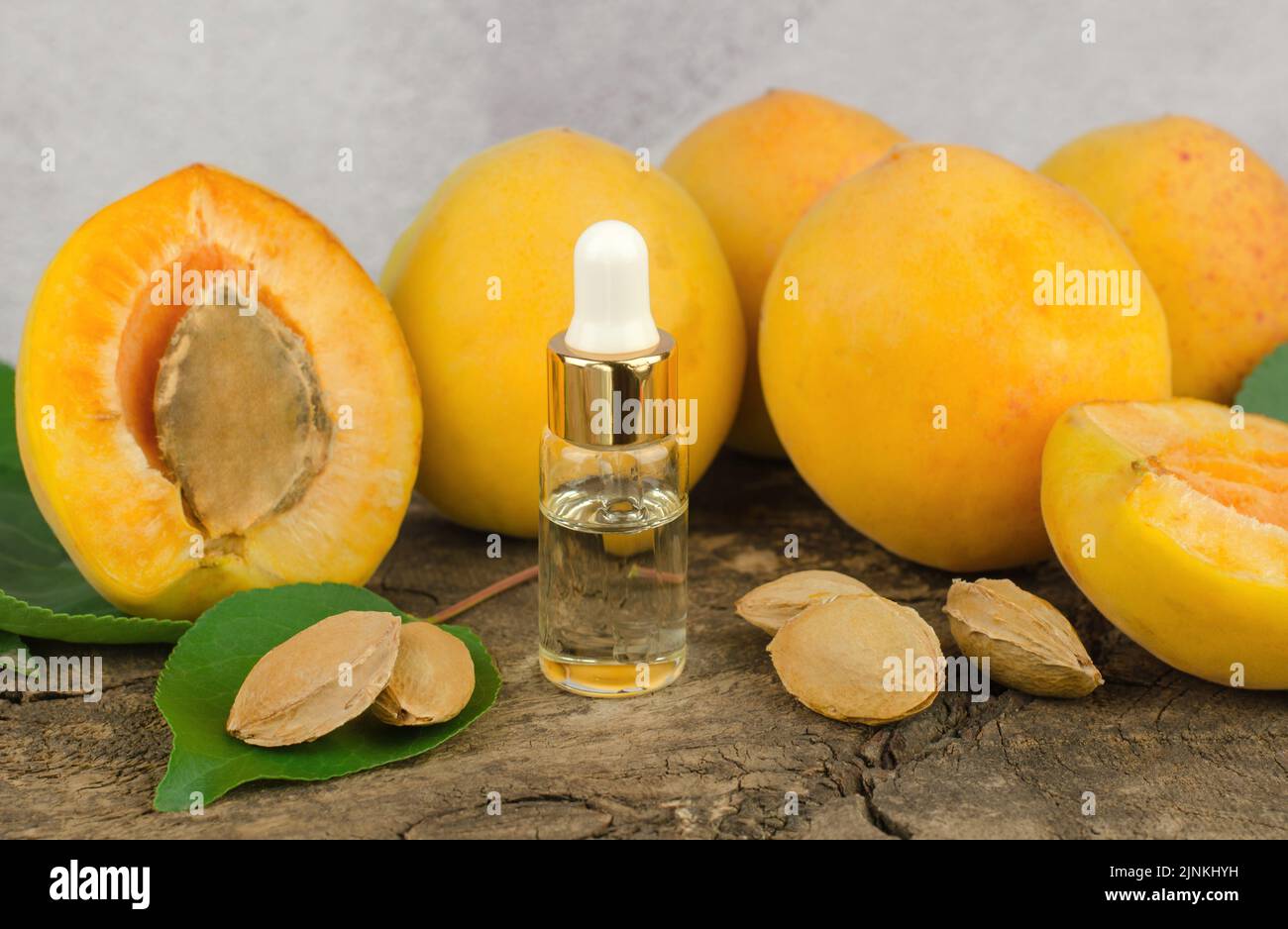 Essential oil of apricot and apricot kernels. Cosmetic bottle with ...