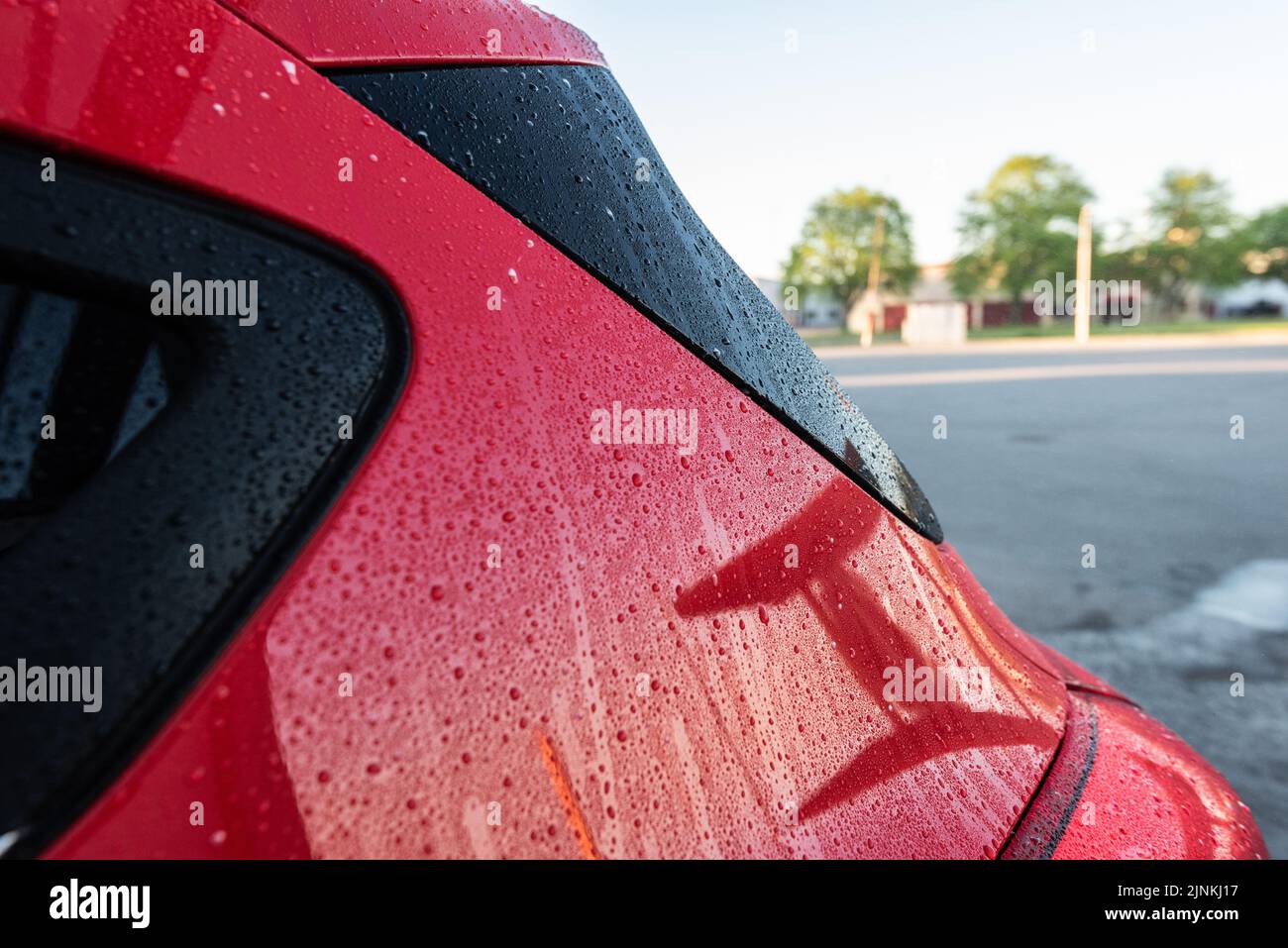 Water drops on the back of a newly washed red car Stock Photo - Alamy