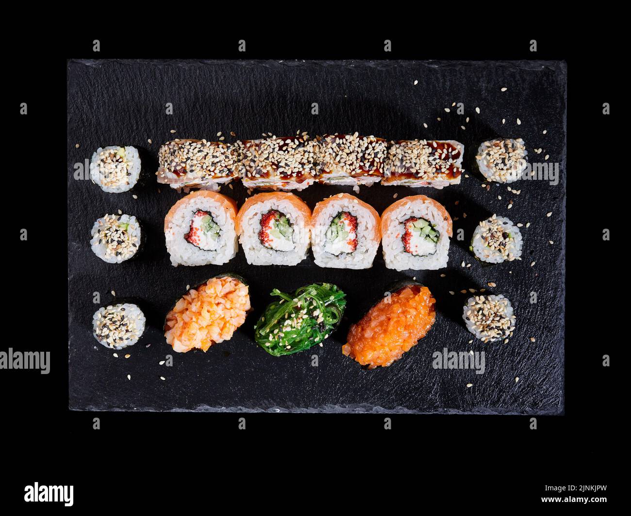 Top view various kinds of sushi served on a dark background. Asian food ...