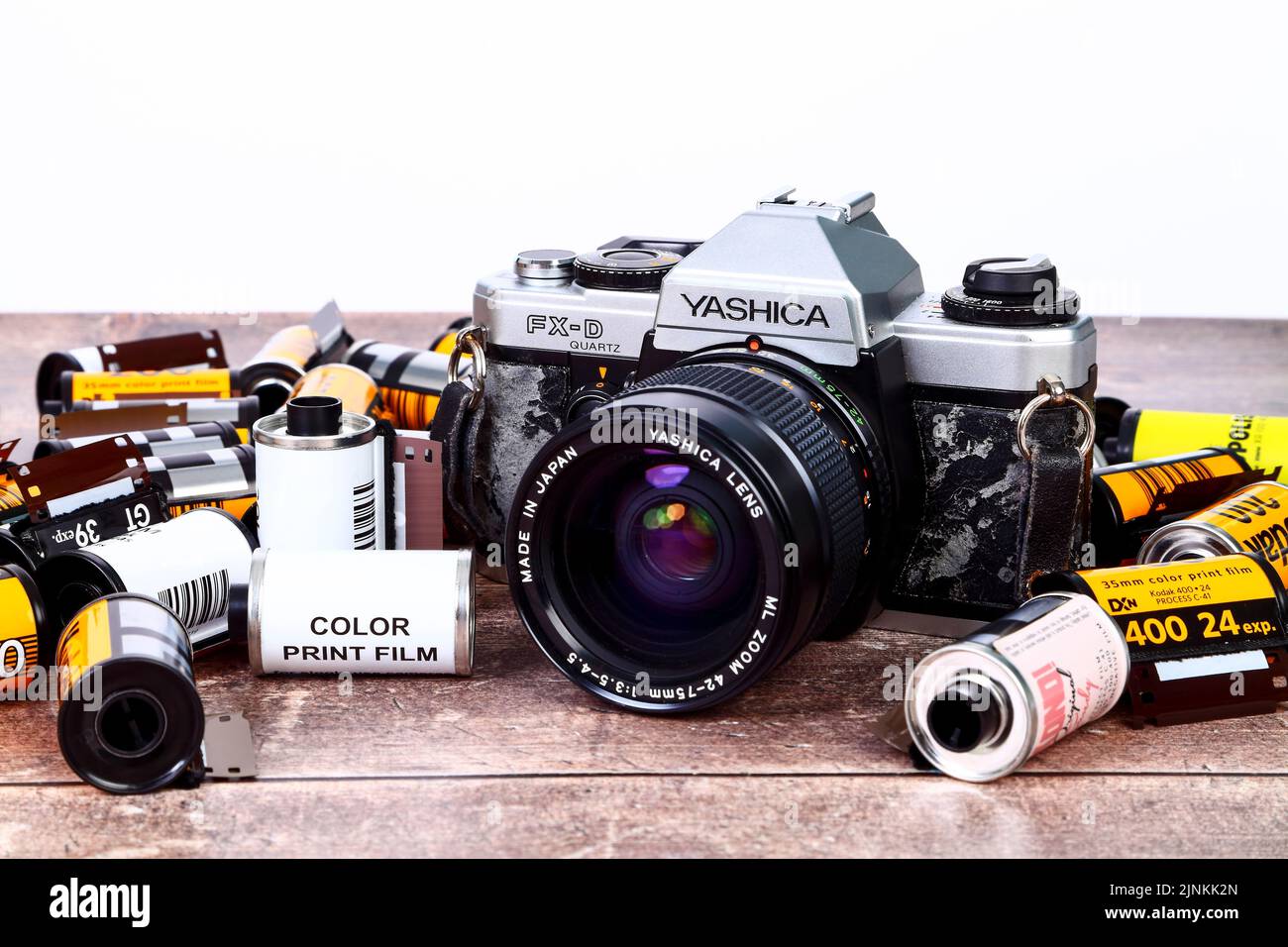 Old battered SLR camera with 35mm film rolls - Editorial use only Stock ...