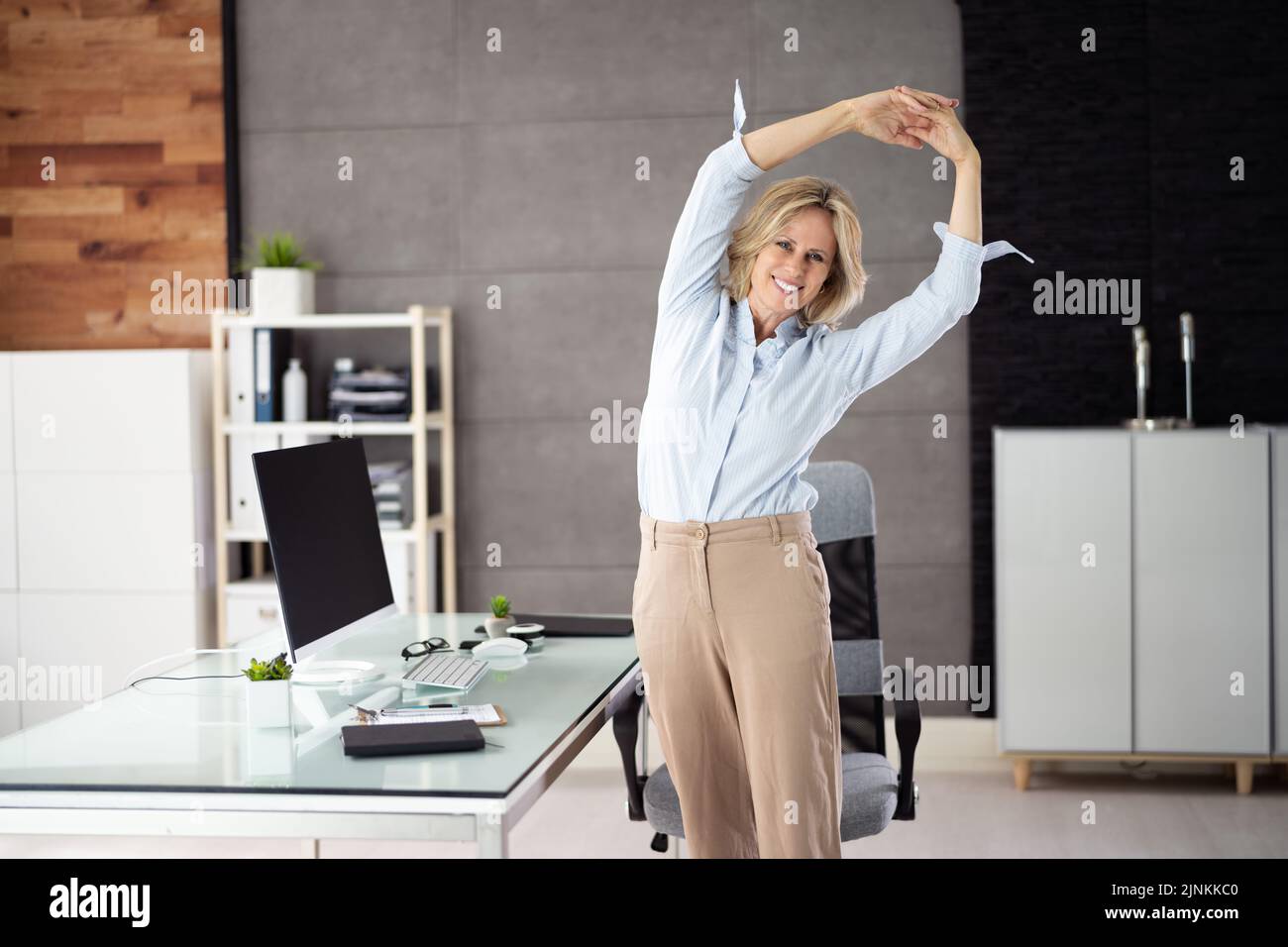 Stretching Office Workout. Desk Stretch Exercise At Workplace Stock ...