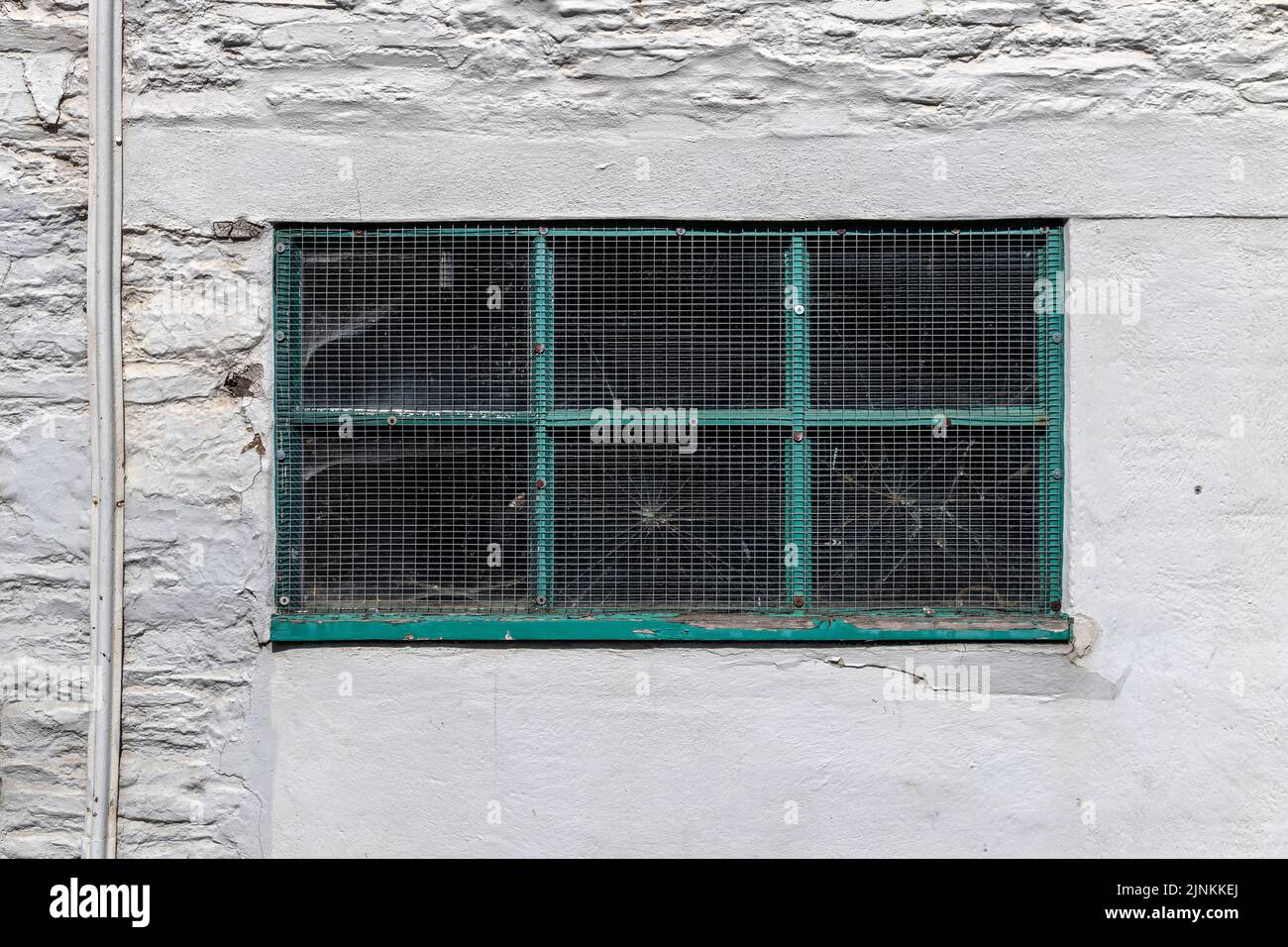 A colourful (lots of character) run down building. Broken windows ...