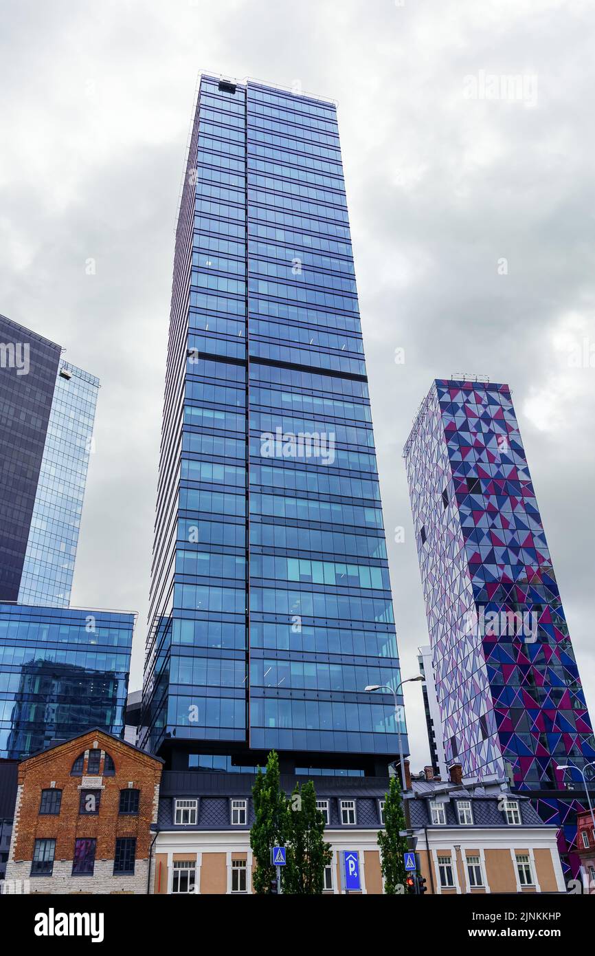 Glass and steel skyscrapers next to old brick buildings in the center ...