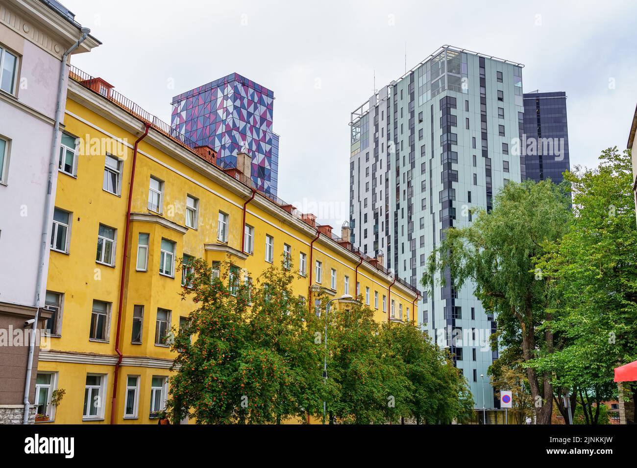 Modern high-rise buildings next to old residential buildings. Tallinn ...
