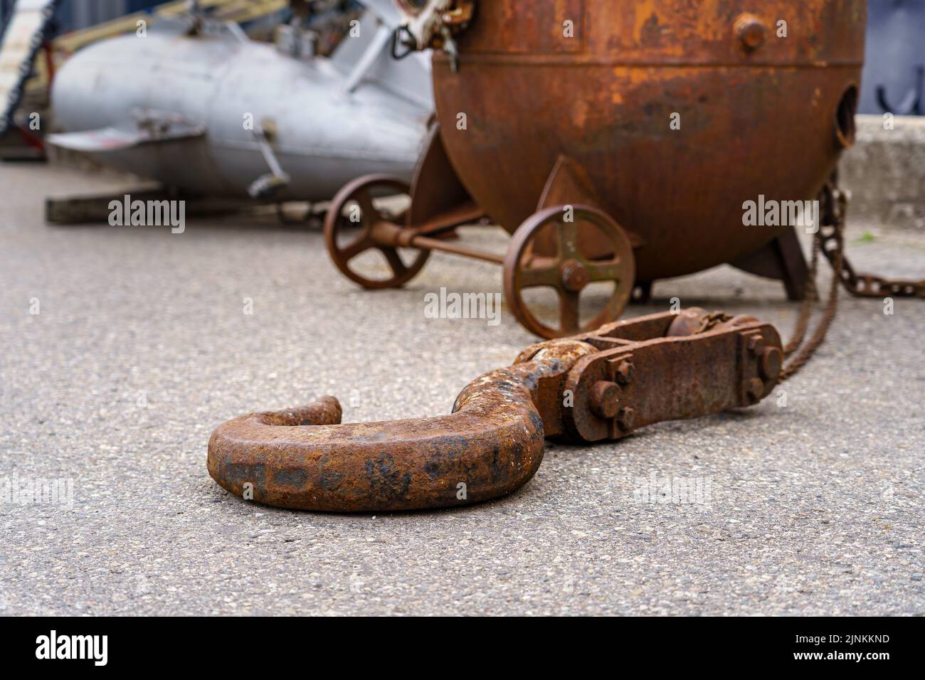 Large rusty iron hook for sea work Stock Photo - Alamy