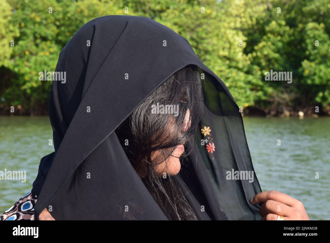 Moor woman hiding her face Stock Photo - Alamy