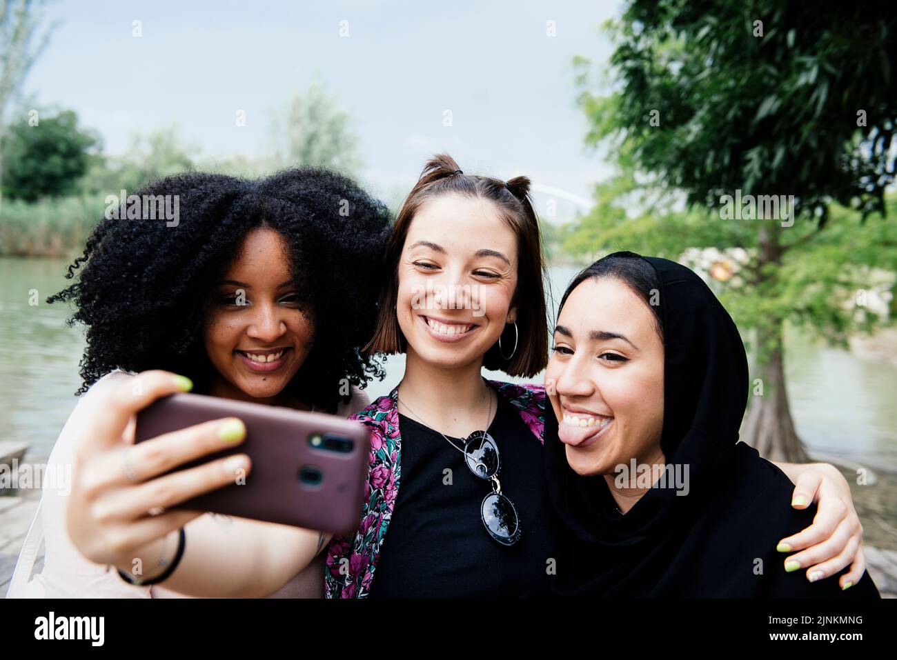 Multicultural friend hug hi-res stock photography and images - Alamy