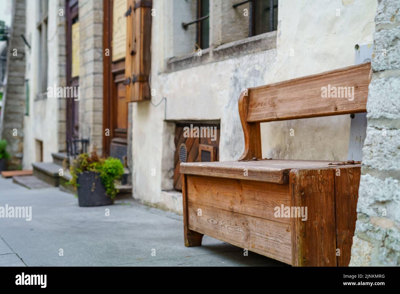 Very old wooden bench in a medieval facade. Tallinn Estonia Stock Photo ...