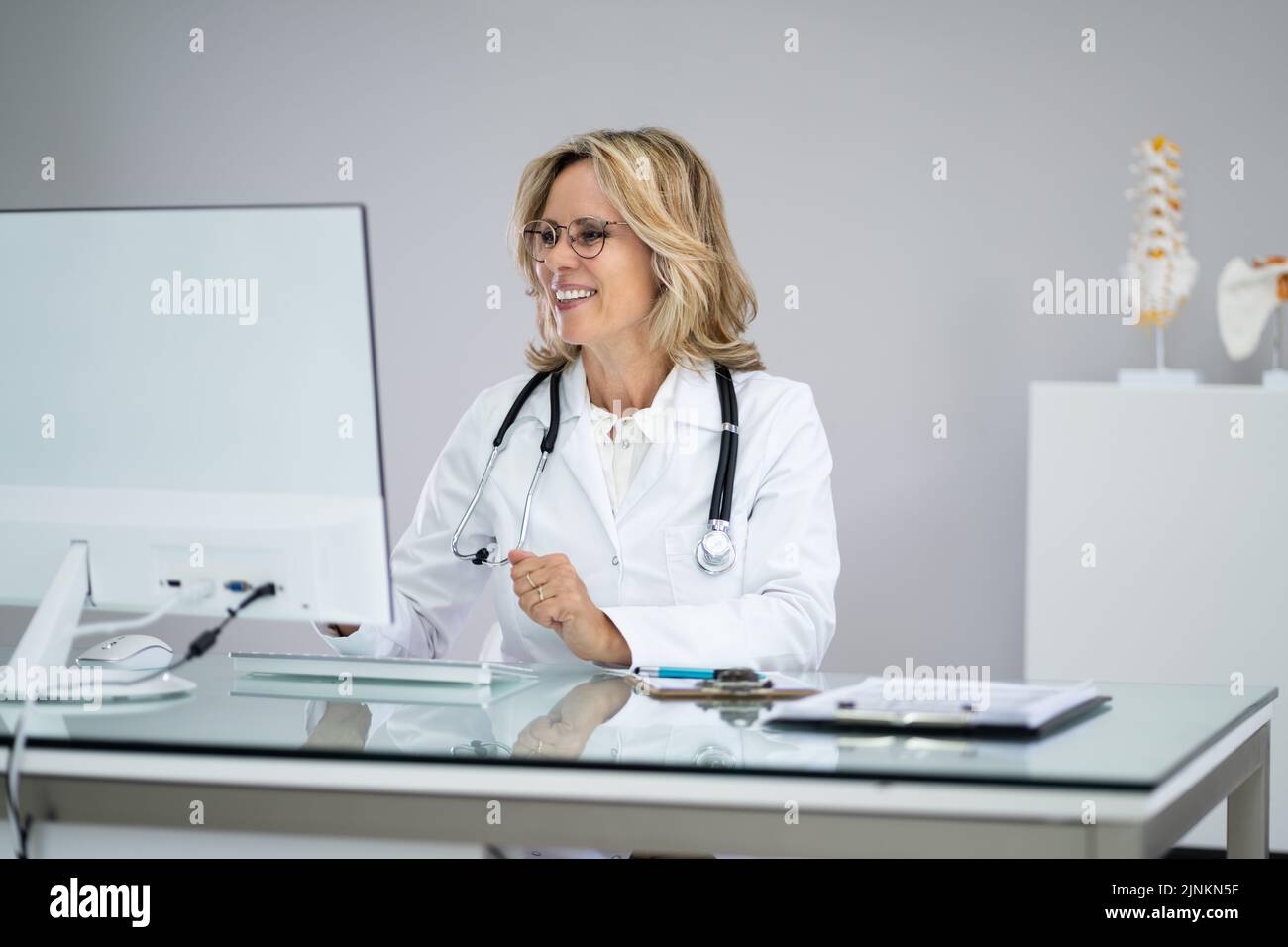 Doctor Video Conference Call On Desktop Computer Stock Photo - Alamy