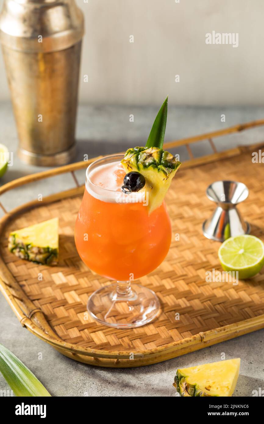 Boozy Cold Rum Runner Cocktail with Cherry and PIneapple Stock Photo ...