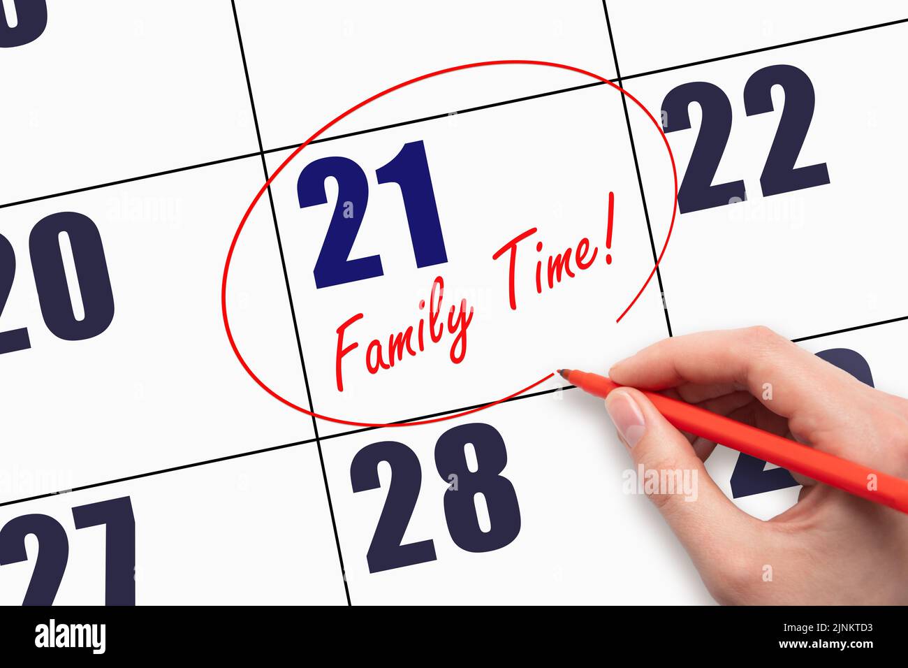 21st day of the month. Hand writing text FAMILY TIME and circling the ...