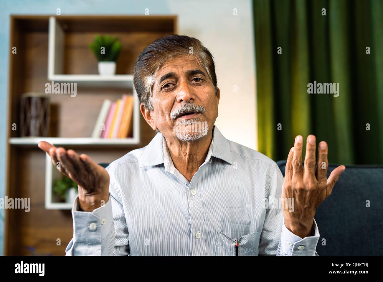 Elderly indian man talking hi-res stock photography and images - Alamy