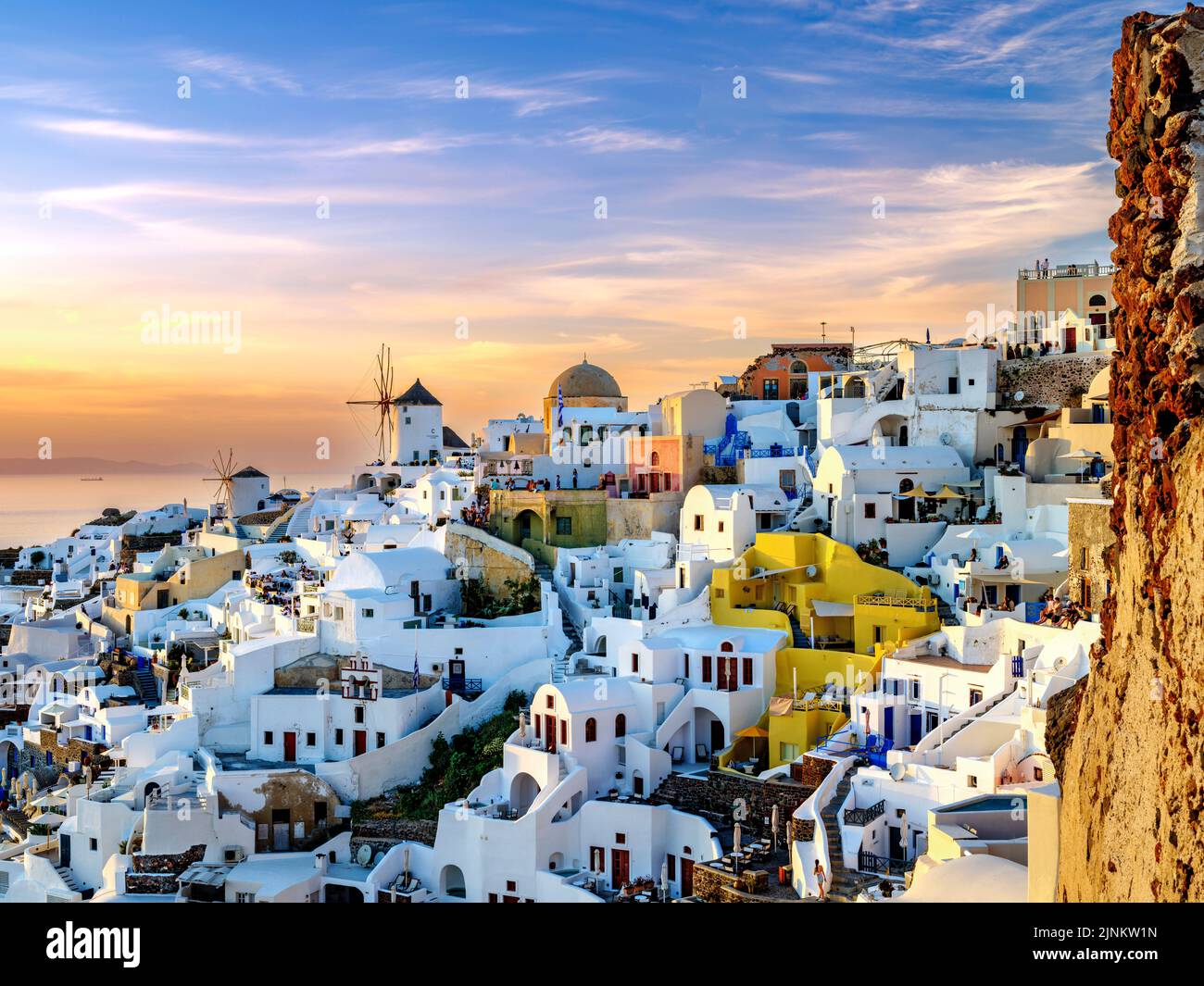 Sunset behind Windmills and classic Greek Architecture,Caldera View ...