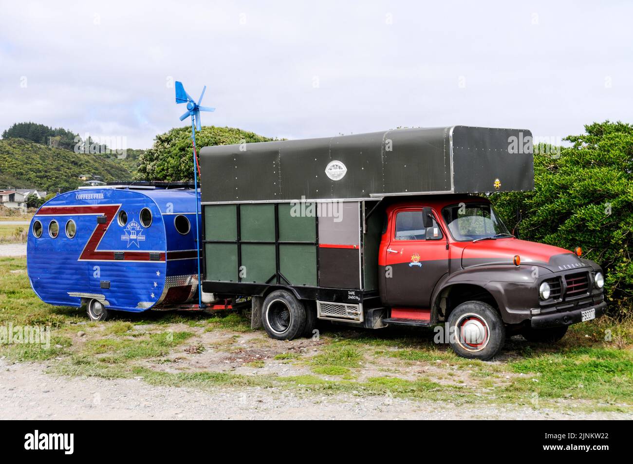 A housetrucker lived-in custom-built bus or lorry parked on open space ...