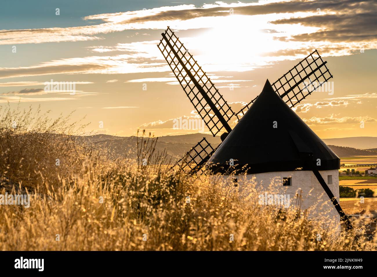 Old windmill photographed at golden hour. Sun in front of the camera ...