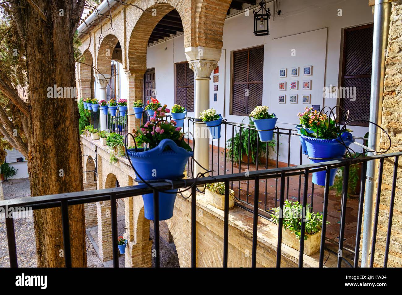 Typical Andalusian balcony with flowers and plants and ancient ...