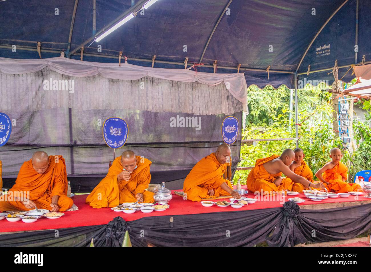 Food offering or food donation to Thai monks as part of a religious and ...