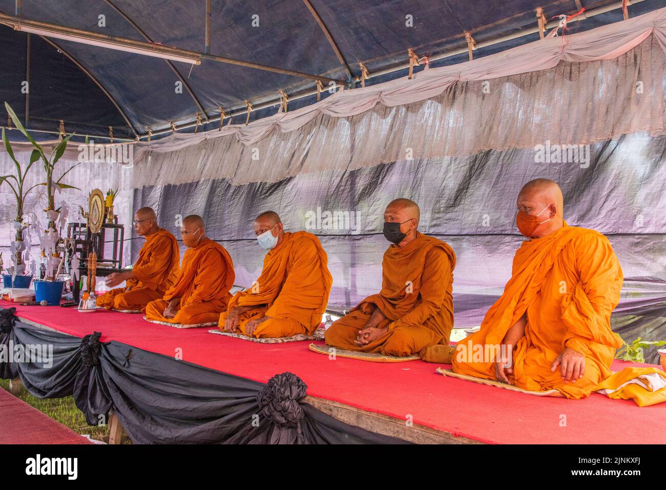 Food offering or food donation to Thai monks as part of a religious and ...
