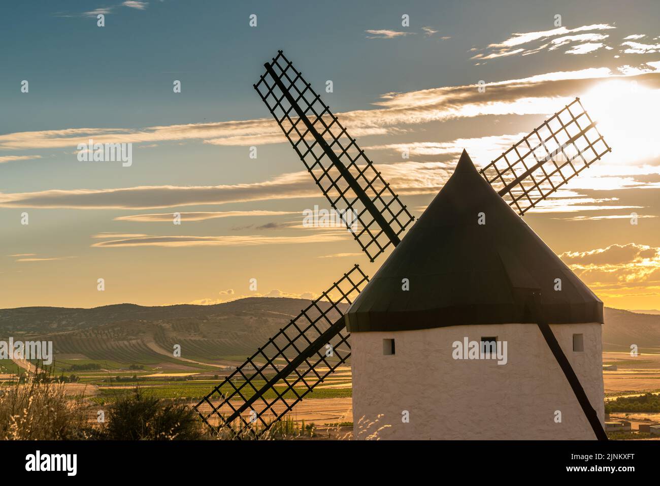 Old windmill photographed at golden hour. Sun in front of the camera ...