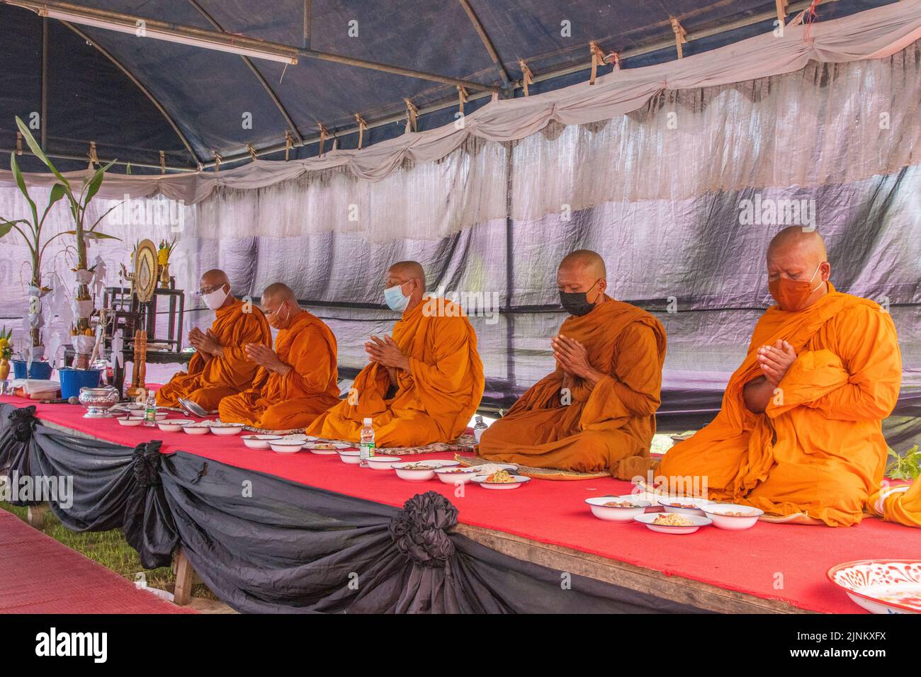 Food offering or food donation to Thai monks as part of a religious and ...