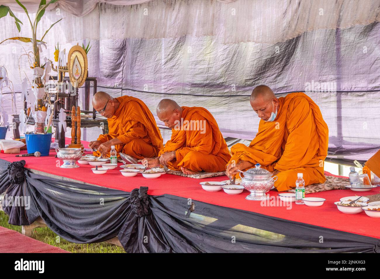 Food offering or food donation to Thai monks as part of a religious and ...