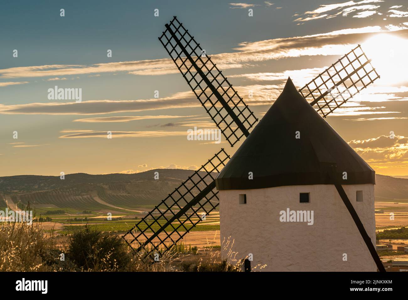 Old windmill photographed at golden hour. Sun in front of the camera ...