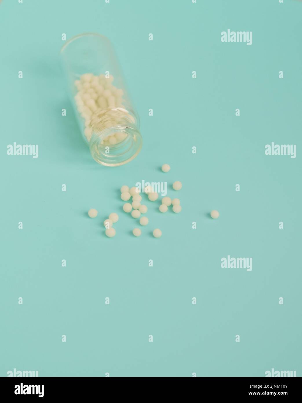 Alternative homeopathy medicine concept. Homeopathic globules scattered ...