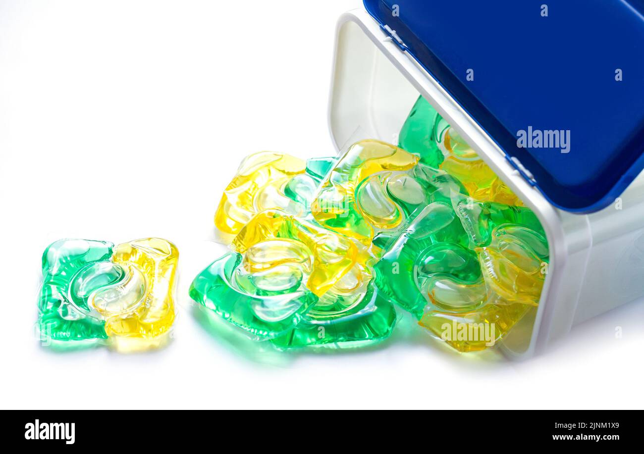Open container with washing gel capsule pods close-up Stock Photo - Alamy