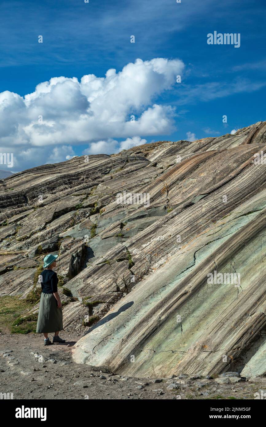 Woman admiring polished stone (green diorite) "shoots", Sacsayhuaman ...