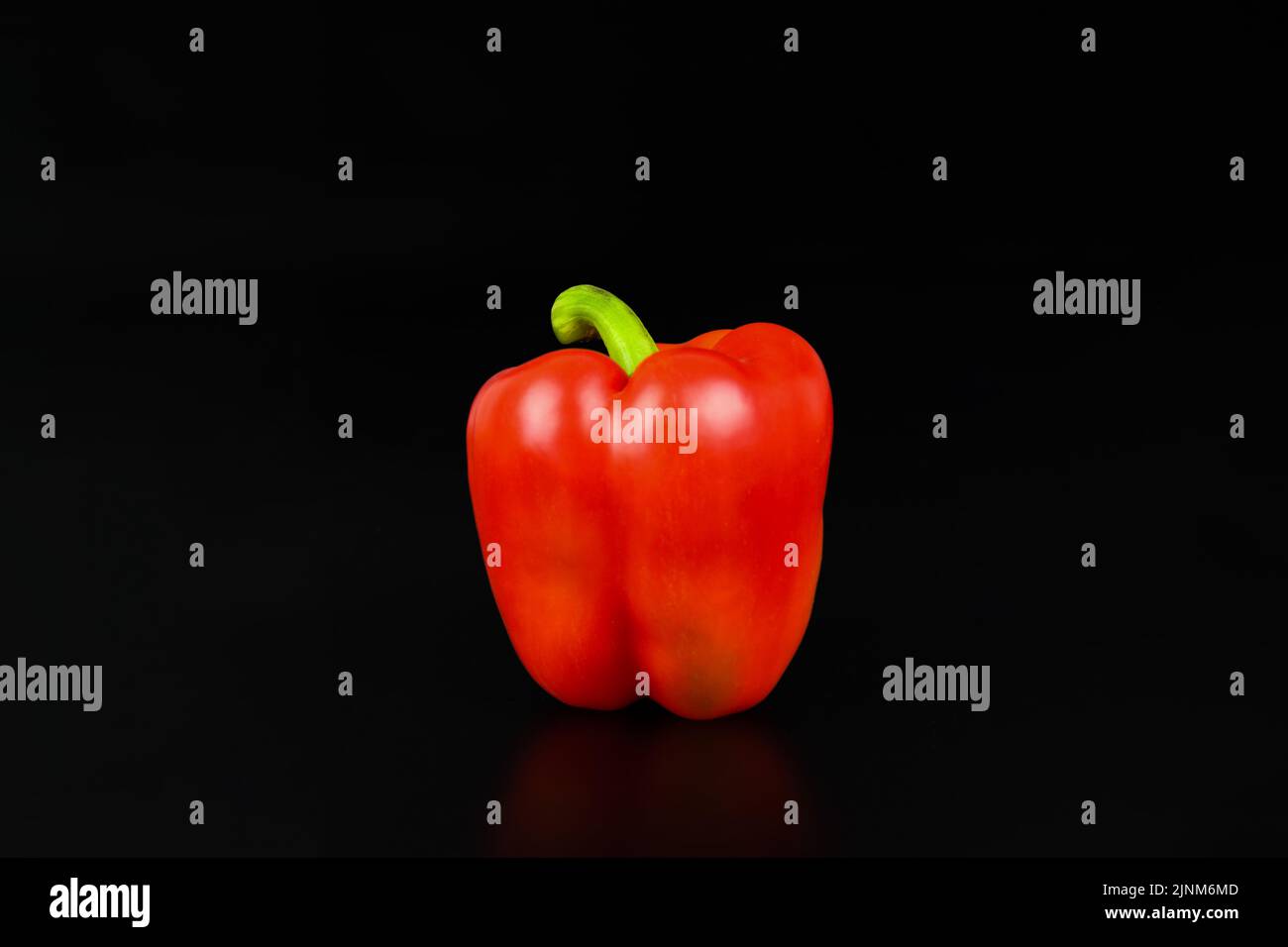 Red bell pepper on black. Close-up image Stock Photo - Alamy
