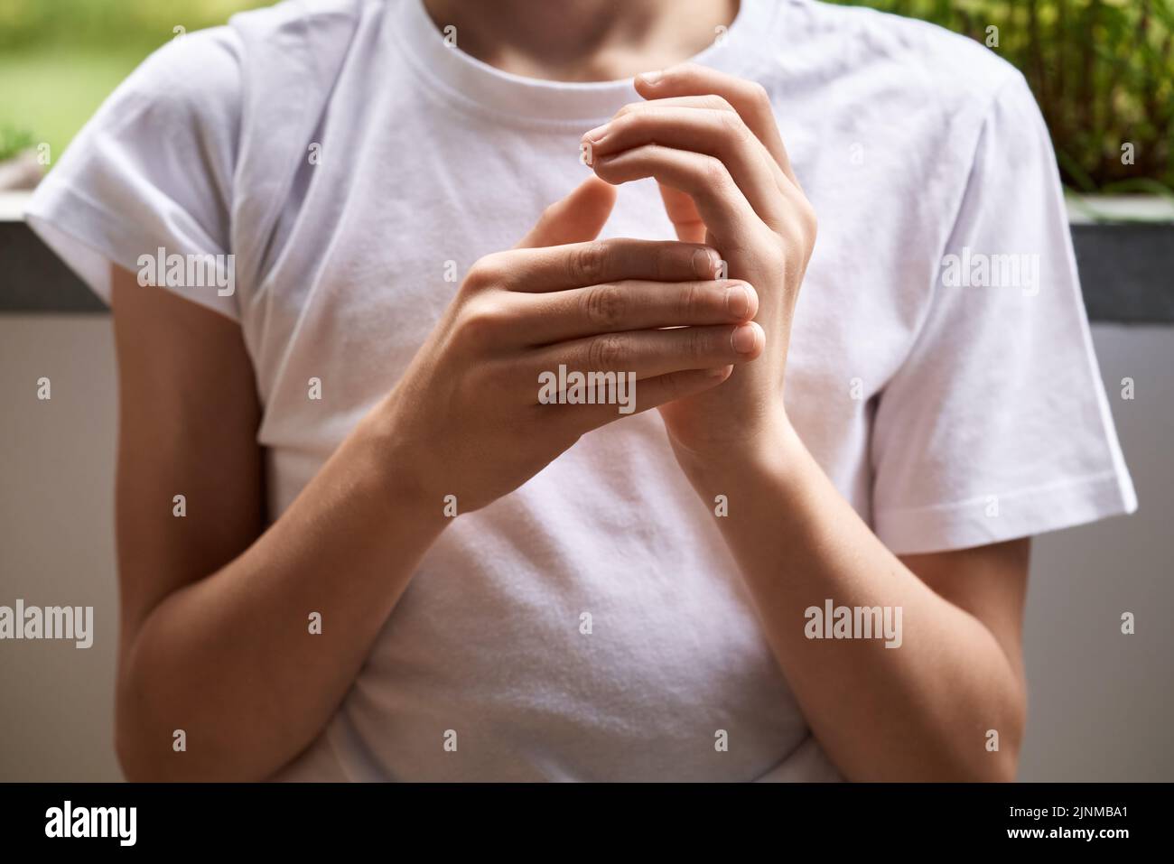 Hands of a childl practicing EFT or emotional freedom technique ...