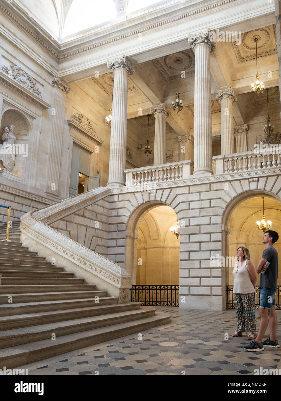 Two tourist looking inside of the Opera house with stairs Stock Photo ...