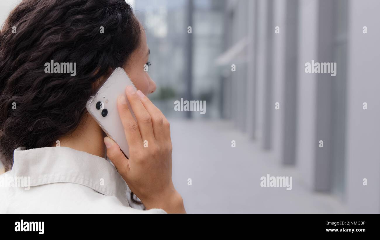 Back view unrecognizable boss manager businesswoman with curly hair ...
