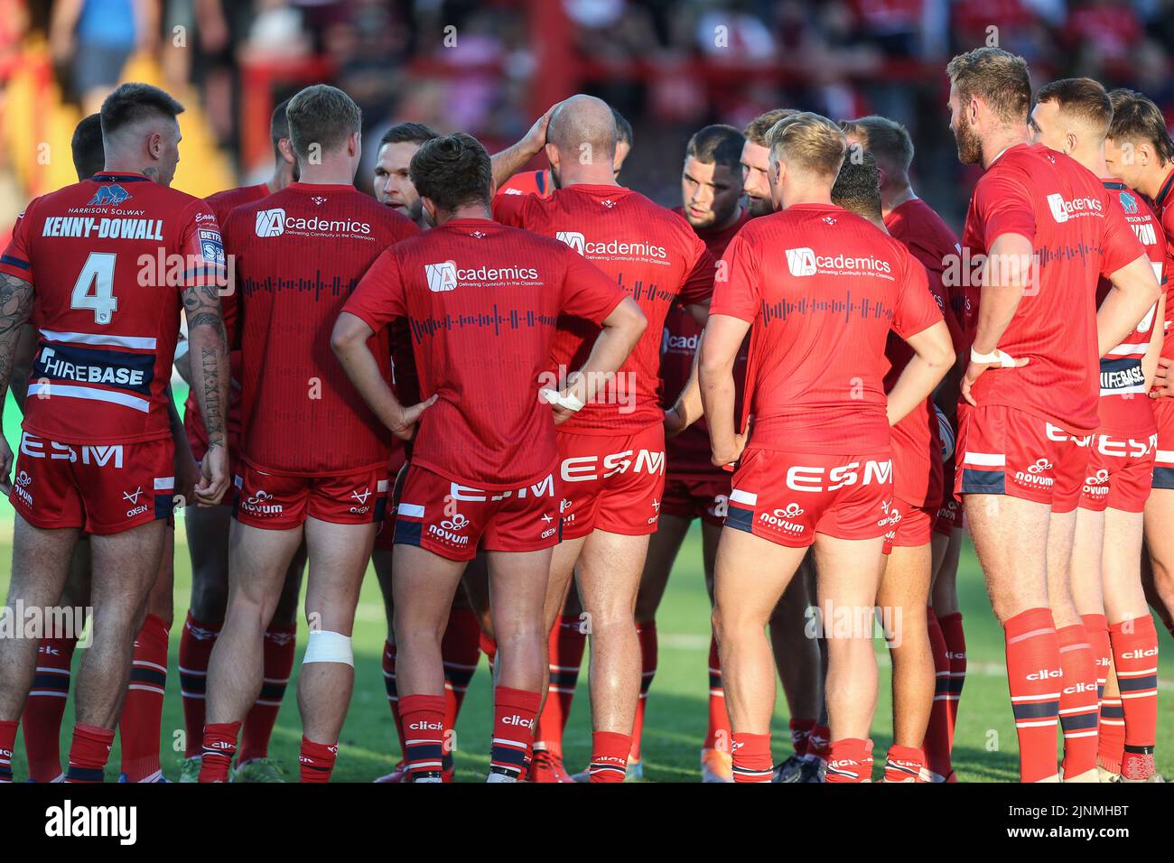 Hull KR players in a huddle during pre-game warm up Stock Photo - Alamy