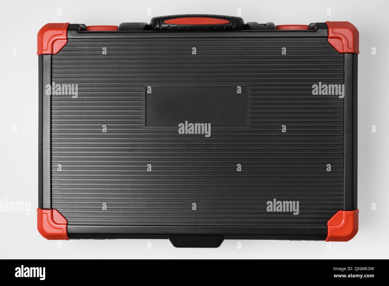 A black box with red inserts for tools on a white table. View from ...