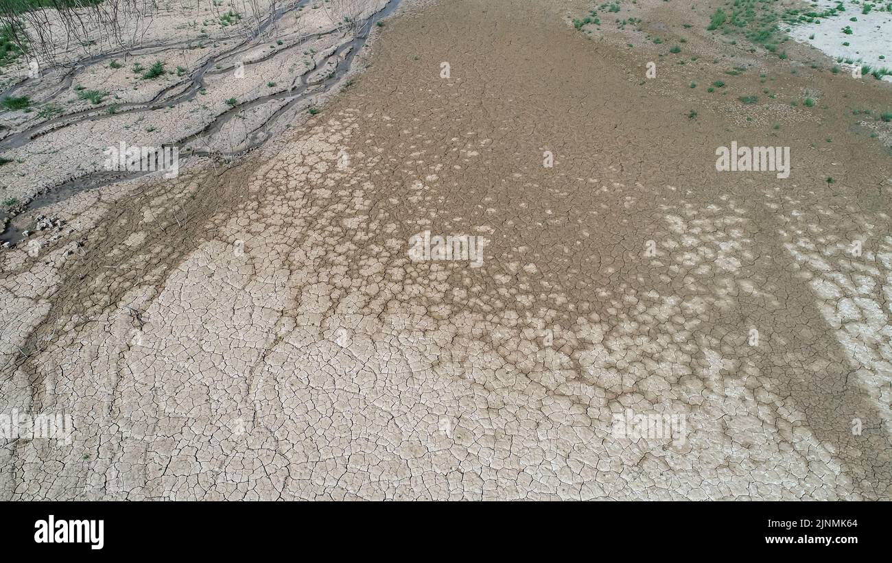 Dry land texture on the floor of a swamp. Global warming and greenhouse ...