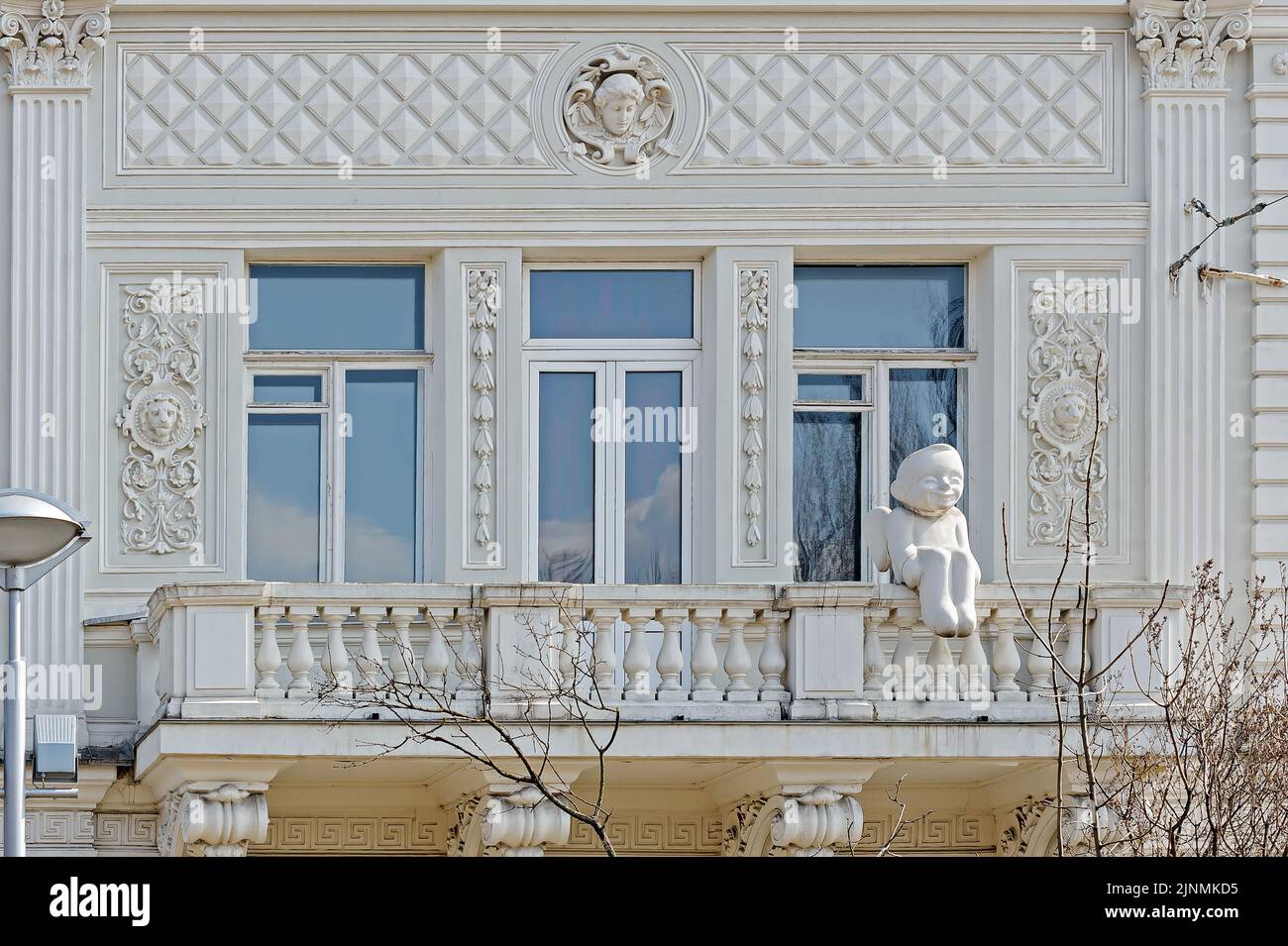 Ornate facade of old museum building with angel on the balcony in Kyiv ...
