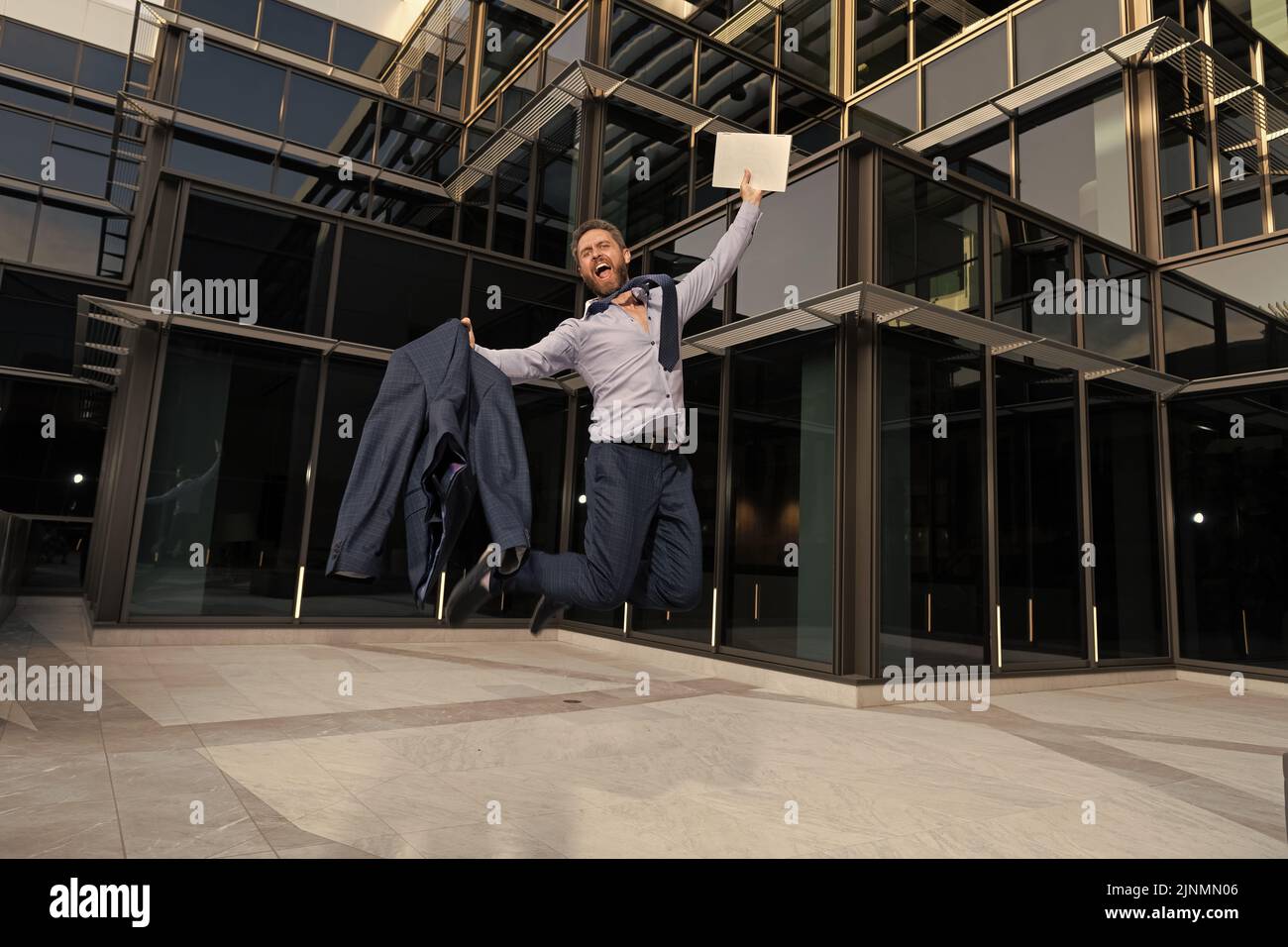 successful happy businessman man jumping with laptop celebrating ...