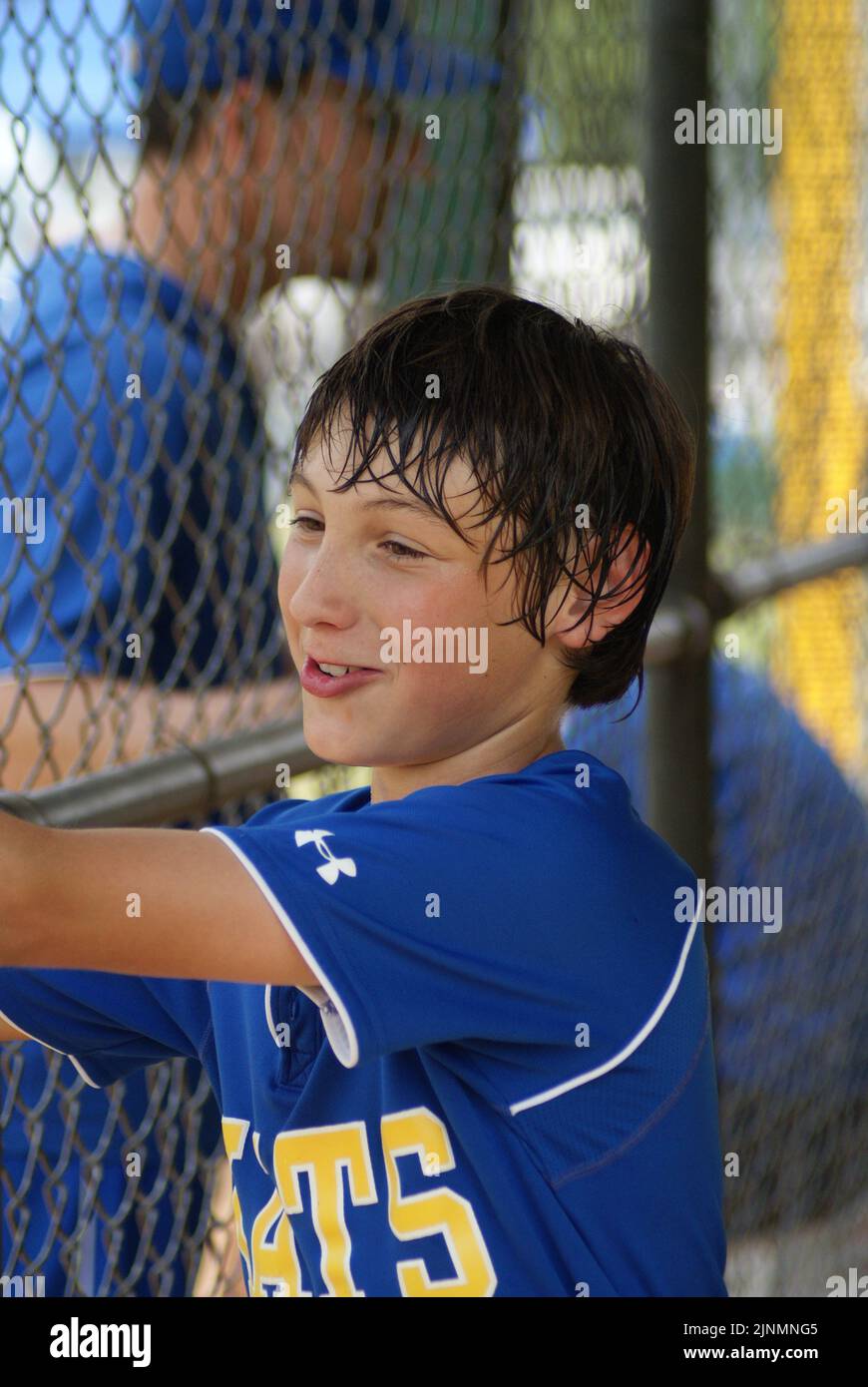 Smiling sweaty youth in the dugout Stock Photo - Alamy