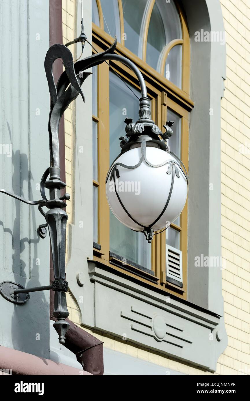 Decorative hanging street lantern mounted on the wall Stock Photo - Alamy